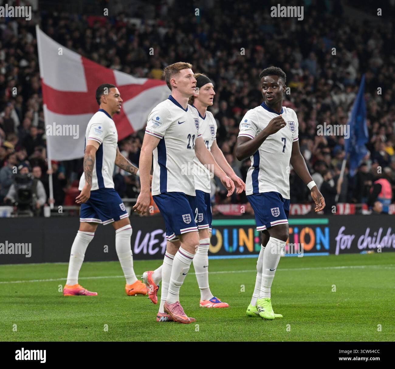 Bukayo Saka of England having a word with team mate Elliot Anderson ...