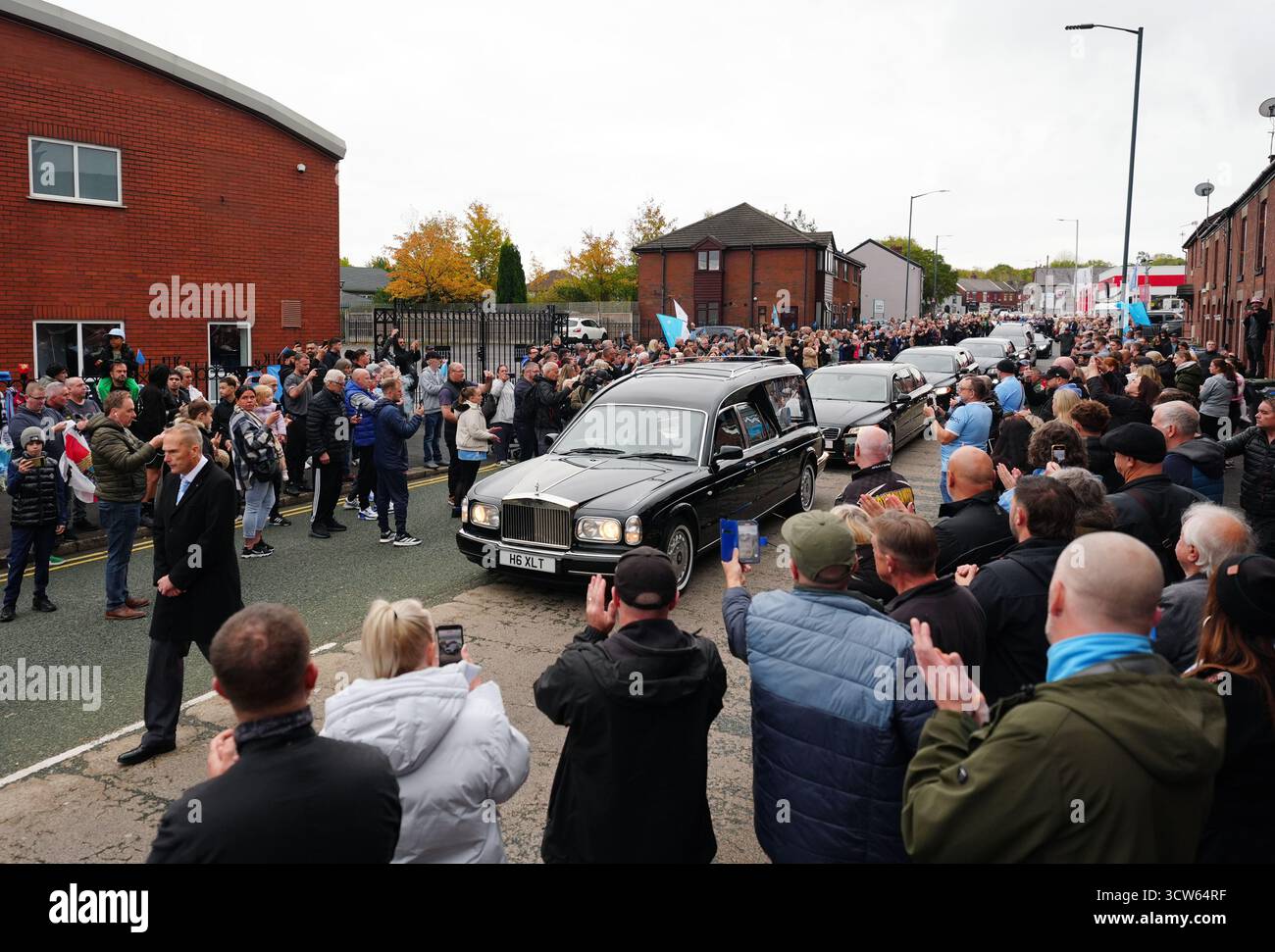 The hearse stops outside Hatton's Gym in Hyde during a procession ...