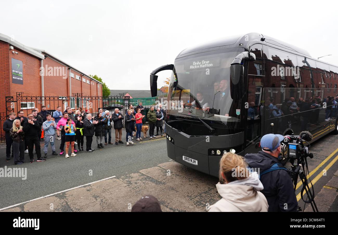 A bus, with a sign saying 'Only One Ricky Hatton' passes outside Hatton ...