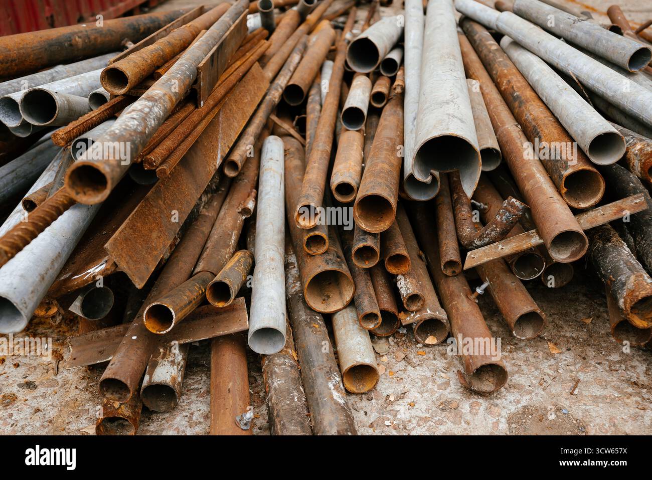 Pile of Rusty Metal Pipes in Scrap Yard Stock Photo - Alamy