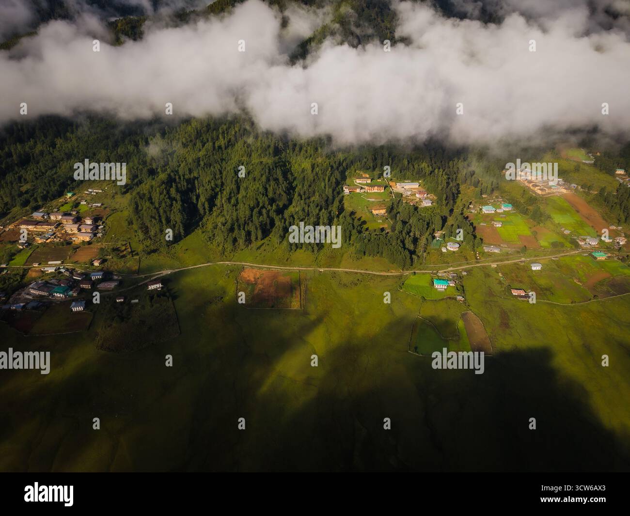 Aerial cloudy valley scattered villages hi-res stock photography and ...