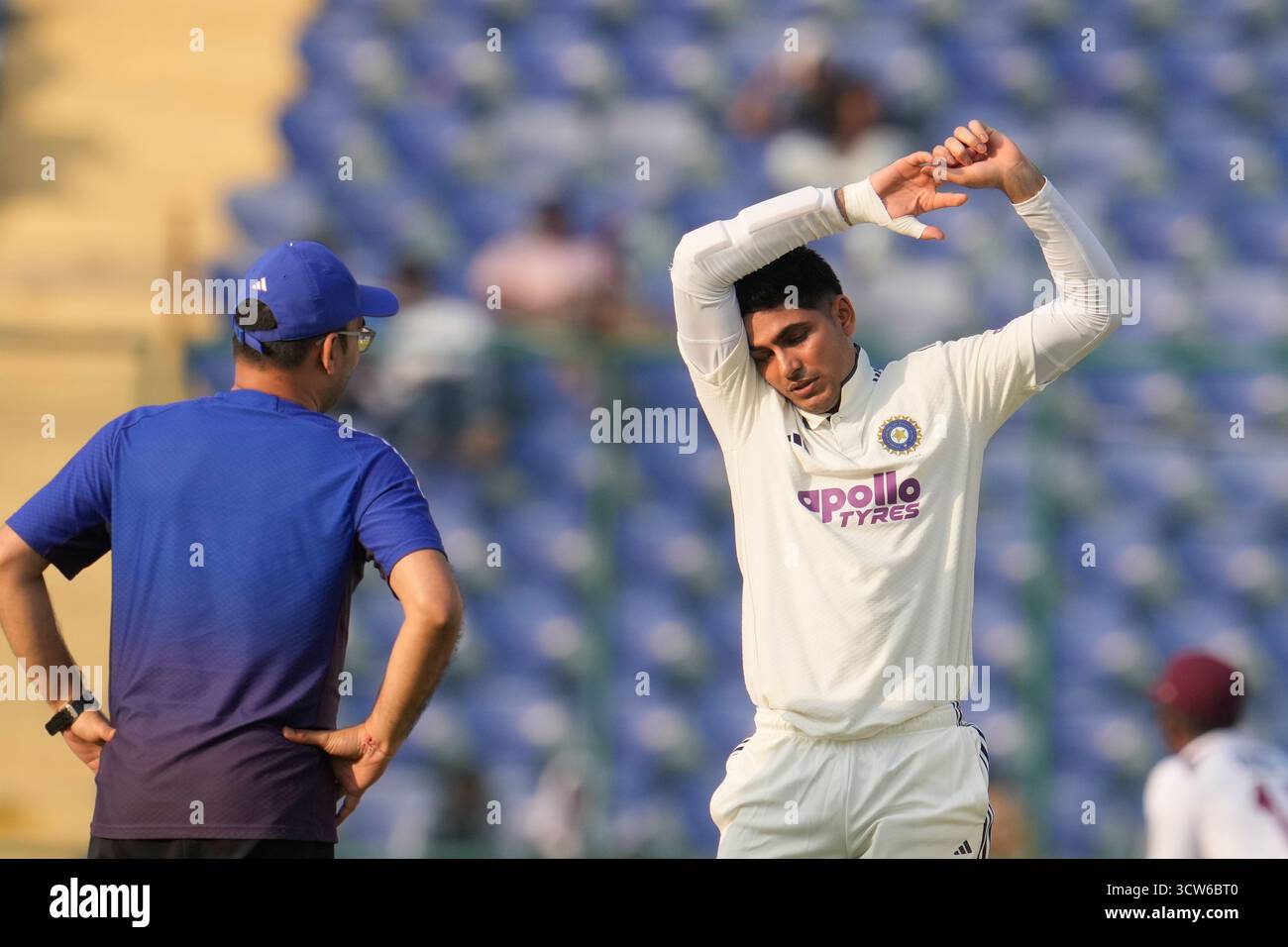 India's captain Shubman Gill, right, reacts after colliding with West ...