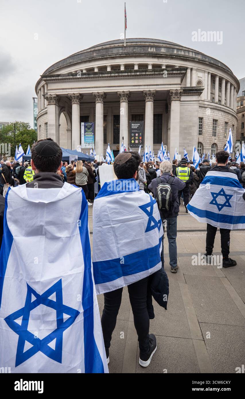 Demonstrators draped in Israeli flags seen at the Manchester central ...