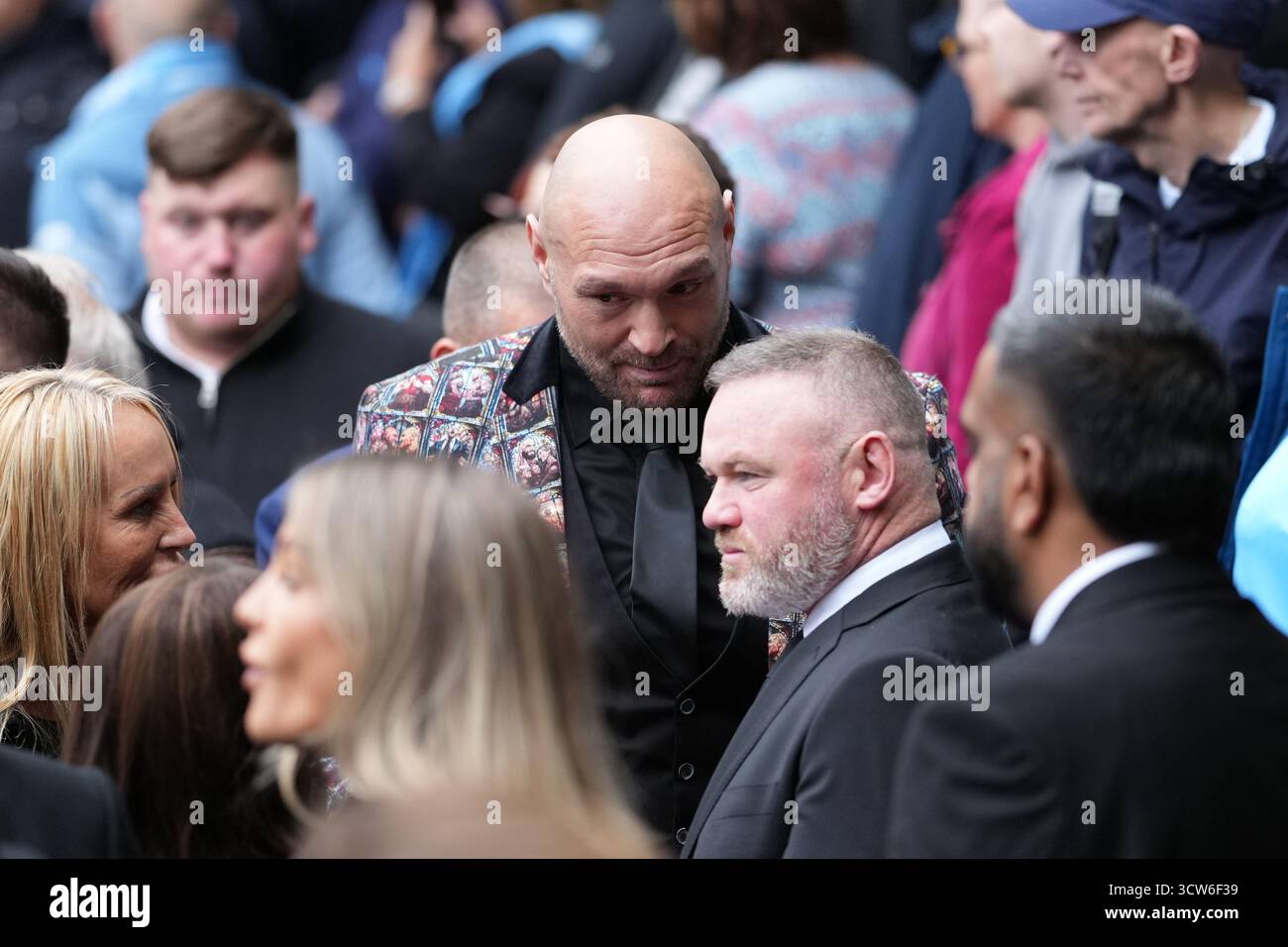 Former soccer player Wayne Rooney, right with boxer Tyson Fury attend ...