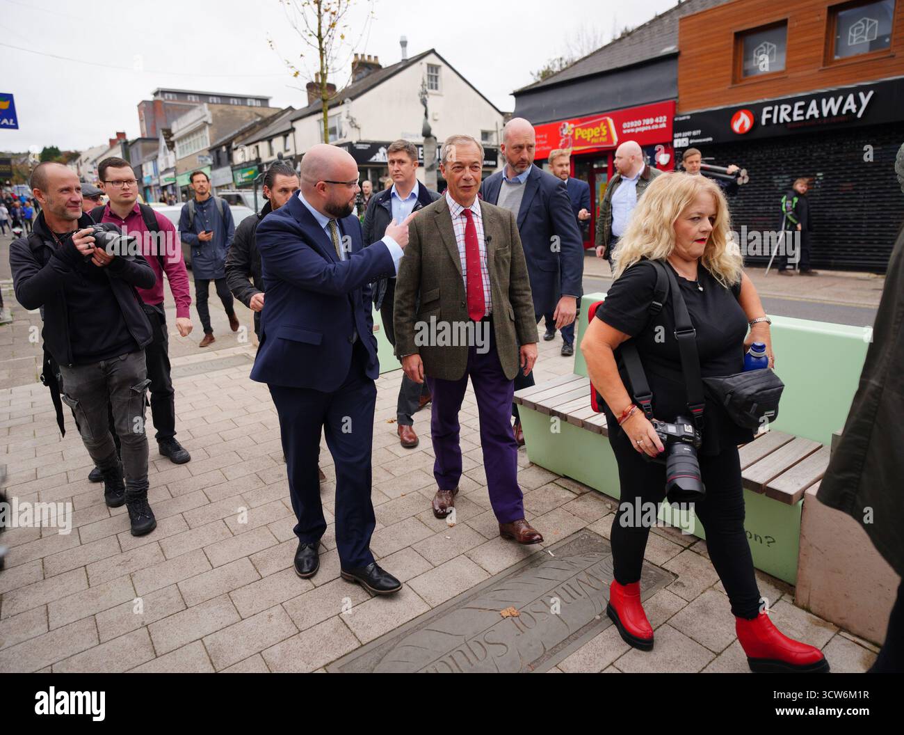 Reform UK leader Nigel Farage (centre) campaigning in Caerphilly, South ...