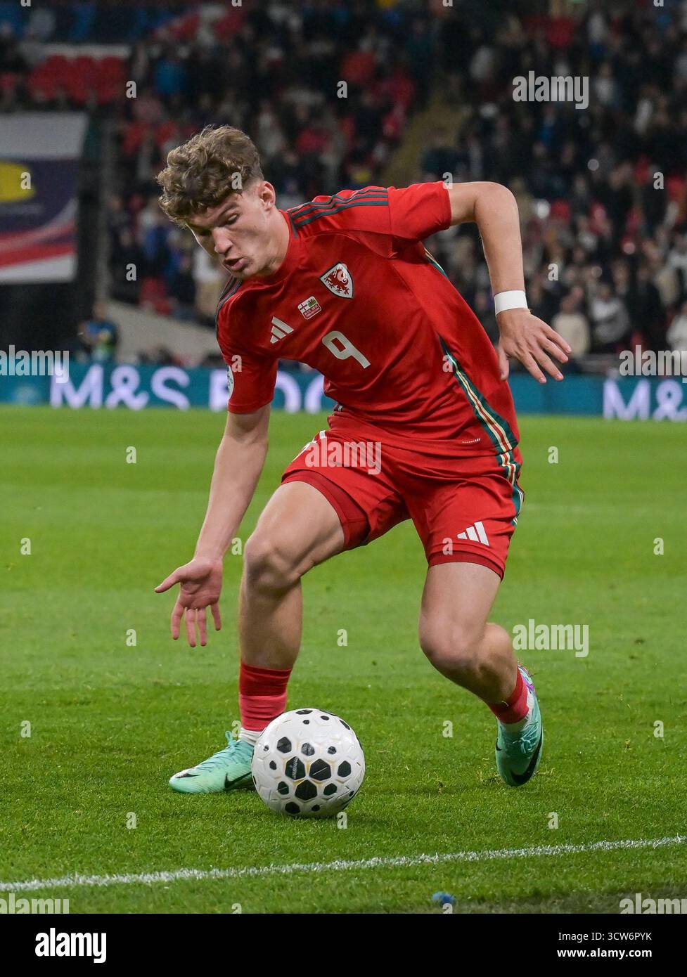 Lewis Koumas of Wales in action during the International Friendly match ...