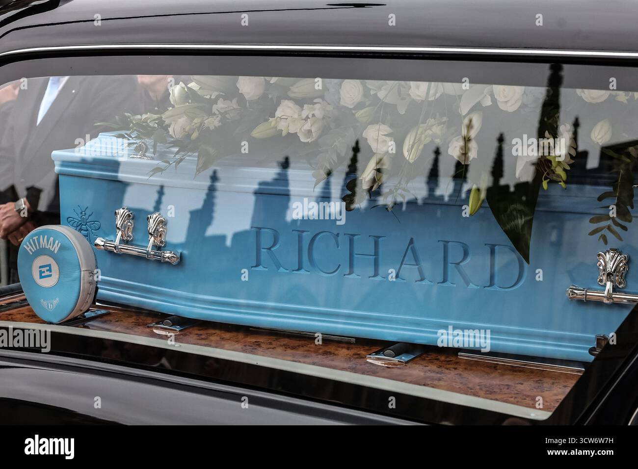 Richard John Hatton MBE’s coffin is placed in the hearse after his ...