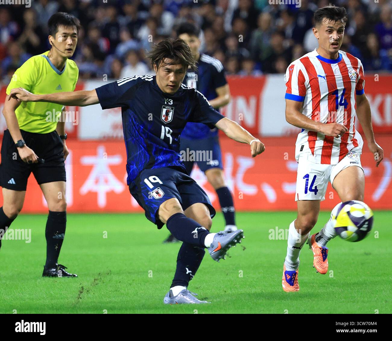 Koki Ogawa of Japan scores in the 1st half of a friendly match against ...
