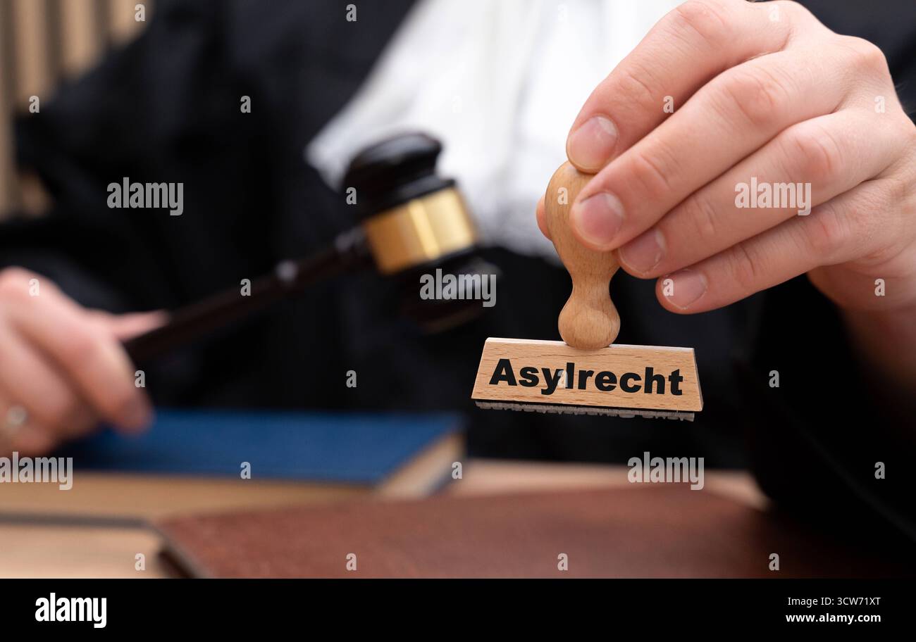 Bavaria, Germany - October 8, 2025: Photomontage, A judge holds a stamp with the inscription ...