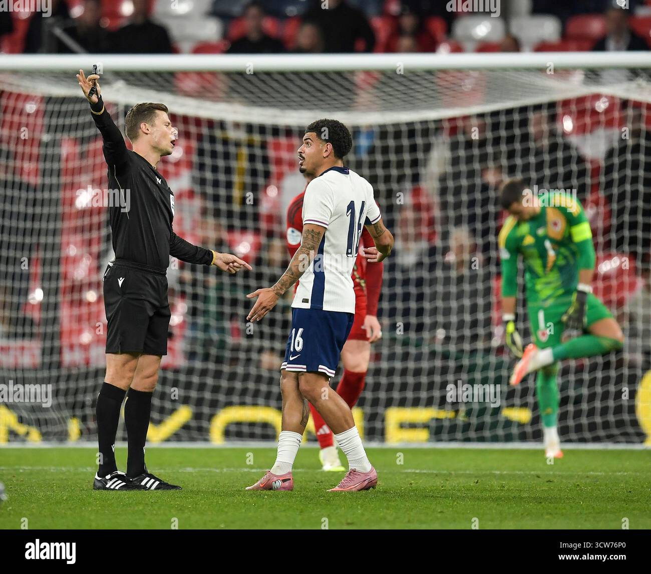 Urs Schnyder (Referee) having words with Morgan Gibbs-White of England ...