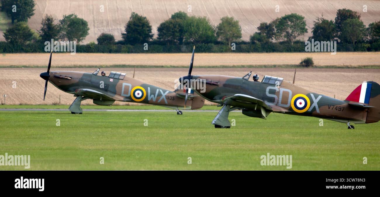 Two WWII, Hawker Hurricanes, taxiing in after after performing in the ...