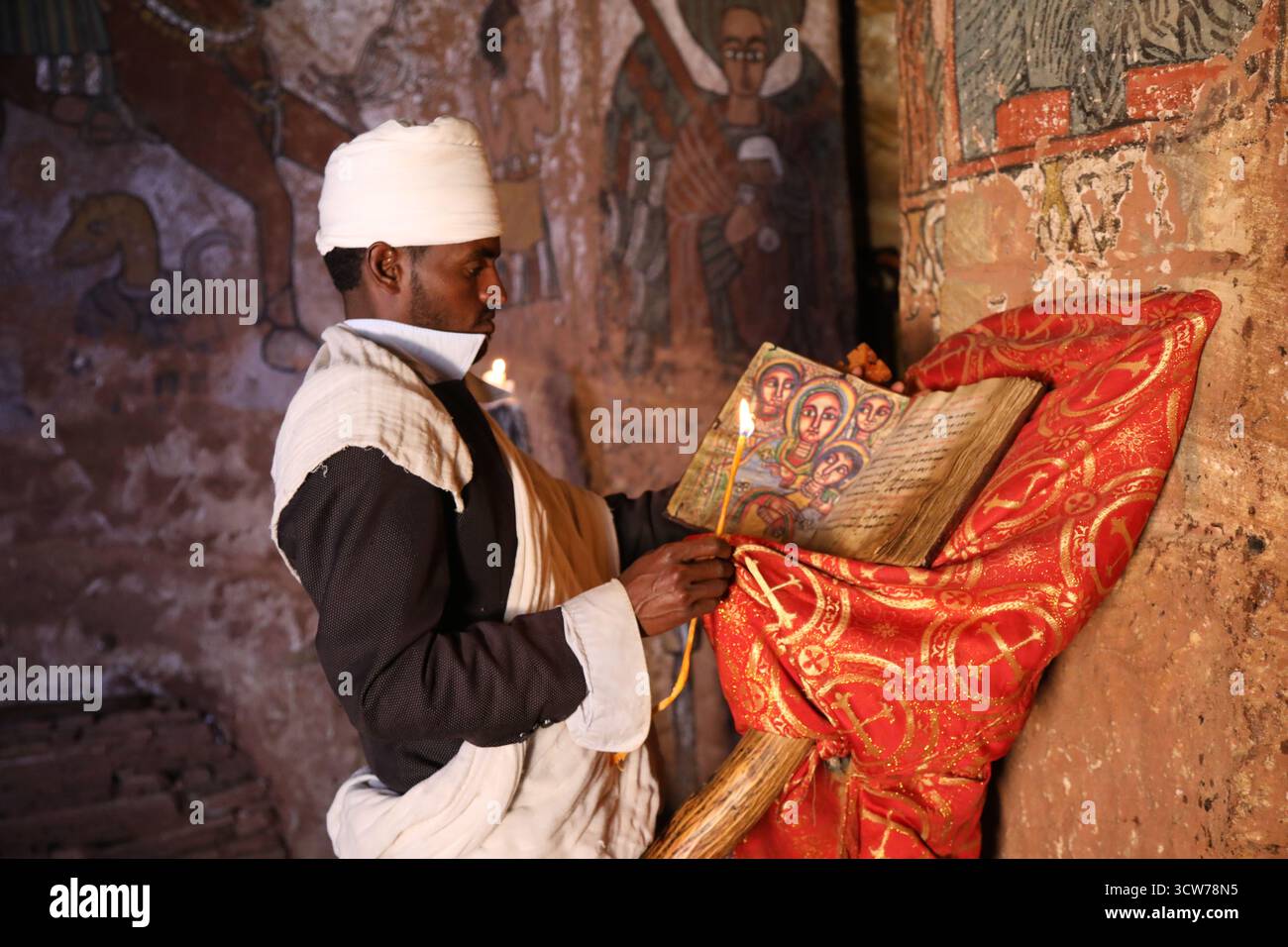 A priest of the Tigray Orthodox Church reads from a centuries-old Ge'ez ...