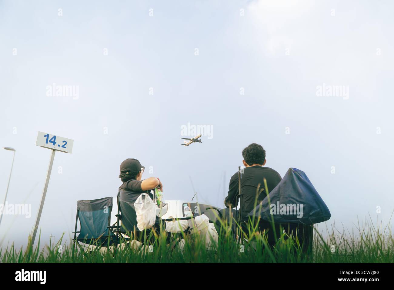 A quiet moment of wonder. Two friends, one sky and a plane tracing ...