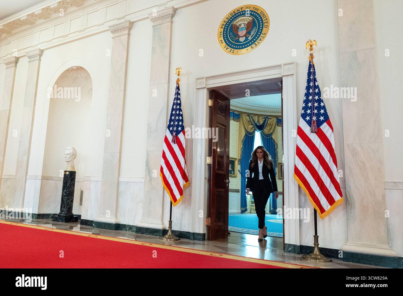 First lady Melania Trump walks from the Blue Room to speak in the Grand ...