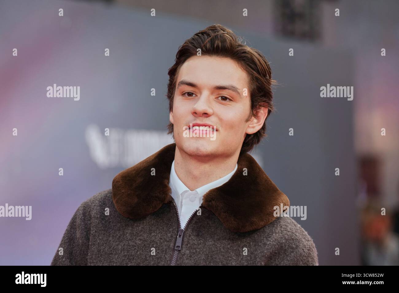 Louis Partridge poses for photographers upon arrival at the premiere of ...