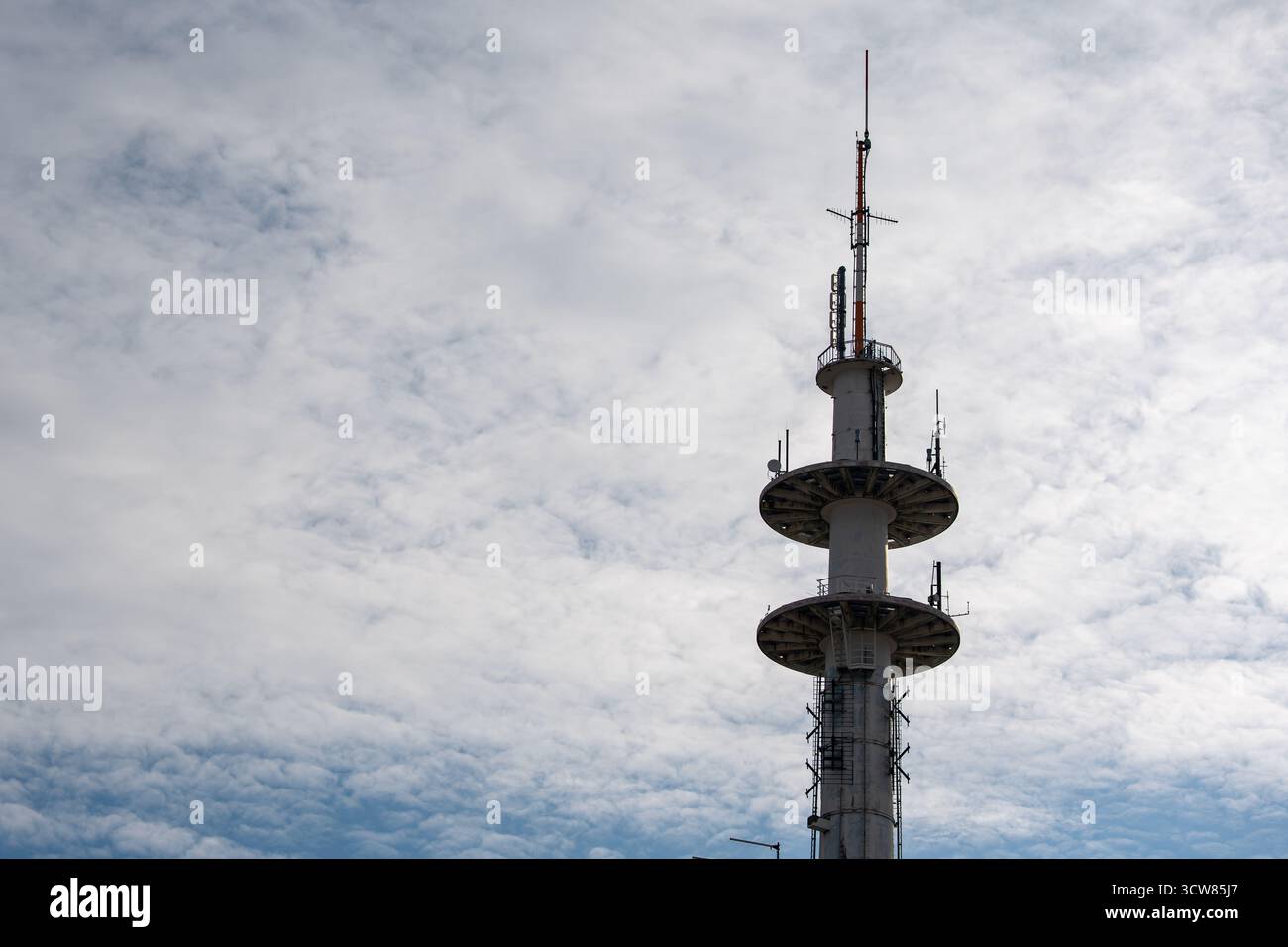 Radio tower close-up. Close view of a tall radio tower with antennas ...