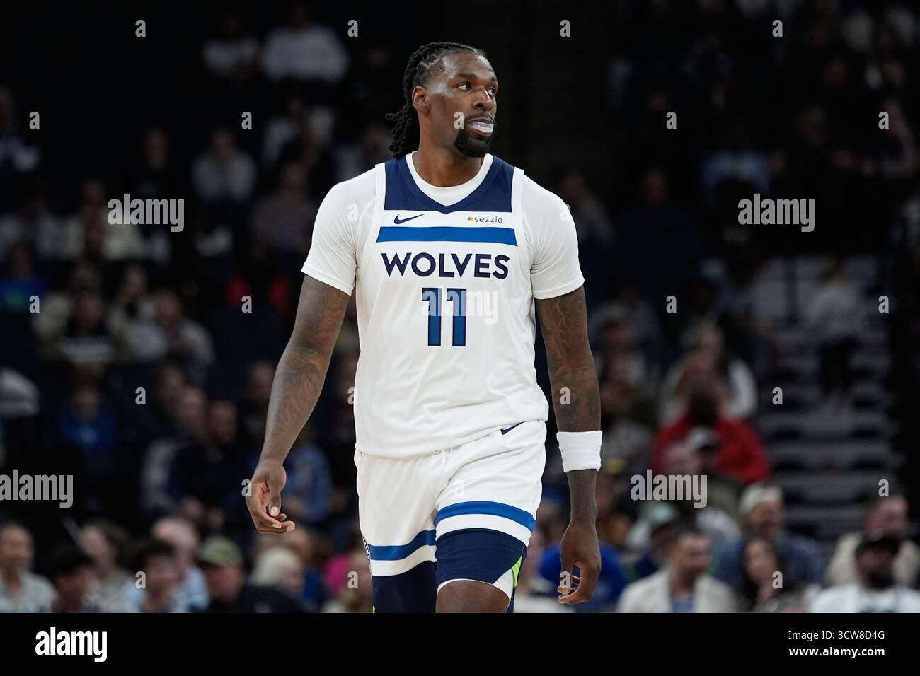Minnesota Timberwolves center Naz Reid (11) walks across the court ...