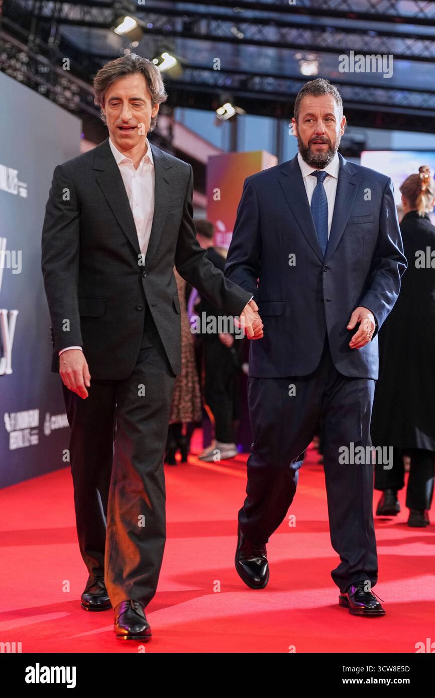 Director Noah Baumbach, left, and Adam Sandler pose for photographers ...