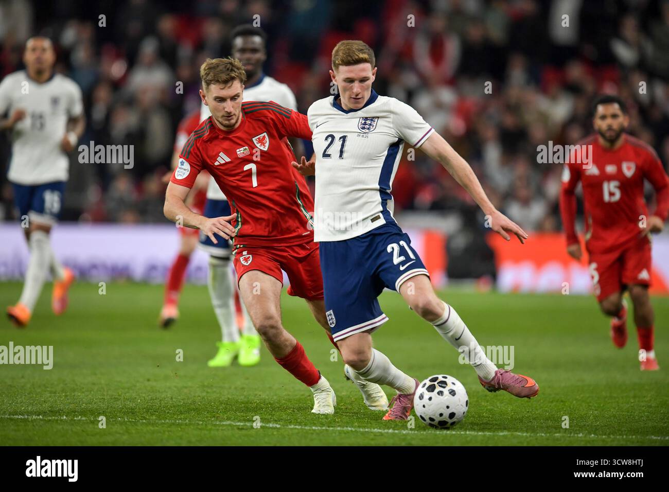 Elliot Anderson of England and David Brooks of Wales in action during ...