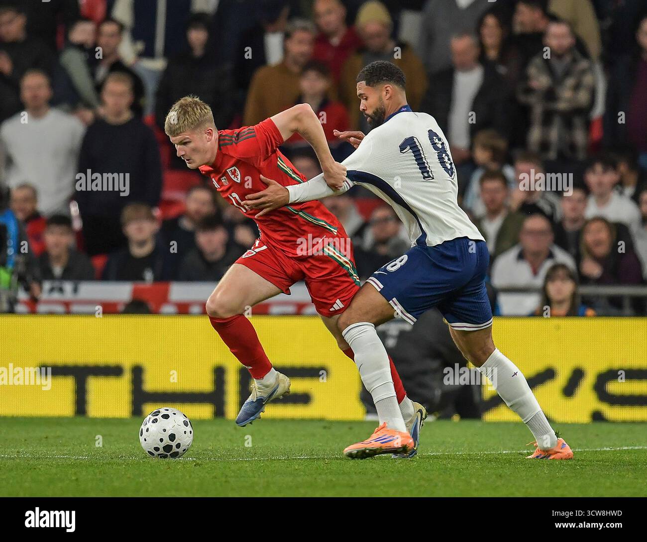 Ruben Loftus-Cheek of England and Jordan James of Wales in action ...