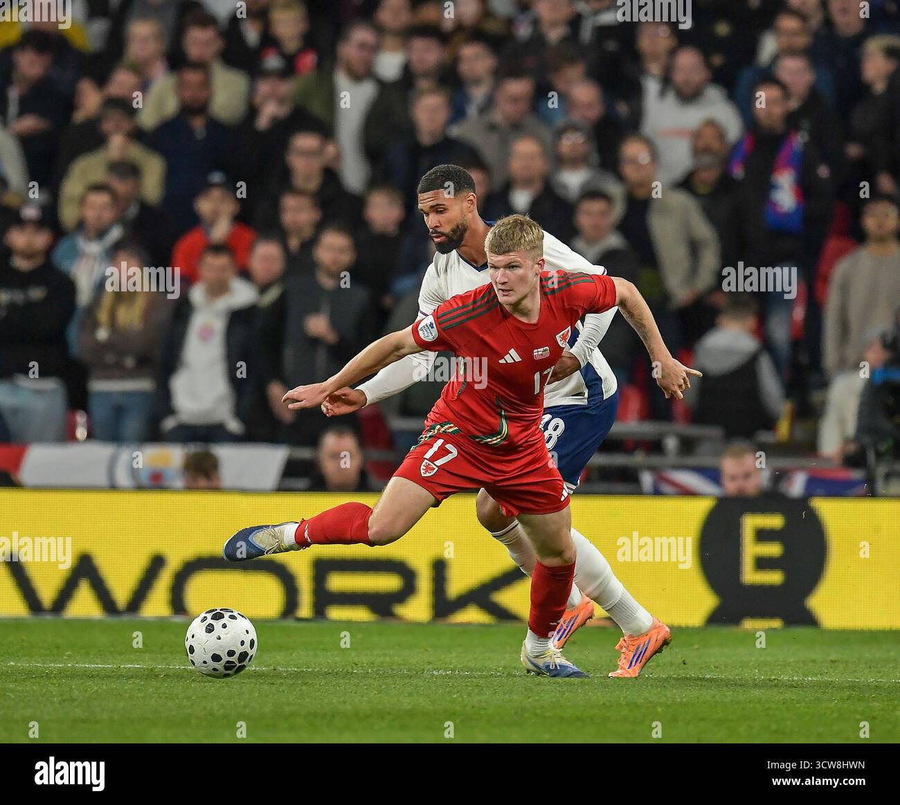 Ruben Loftus-Cheek of England and Jordan James of Wales in action ...