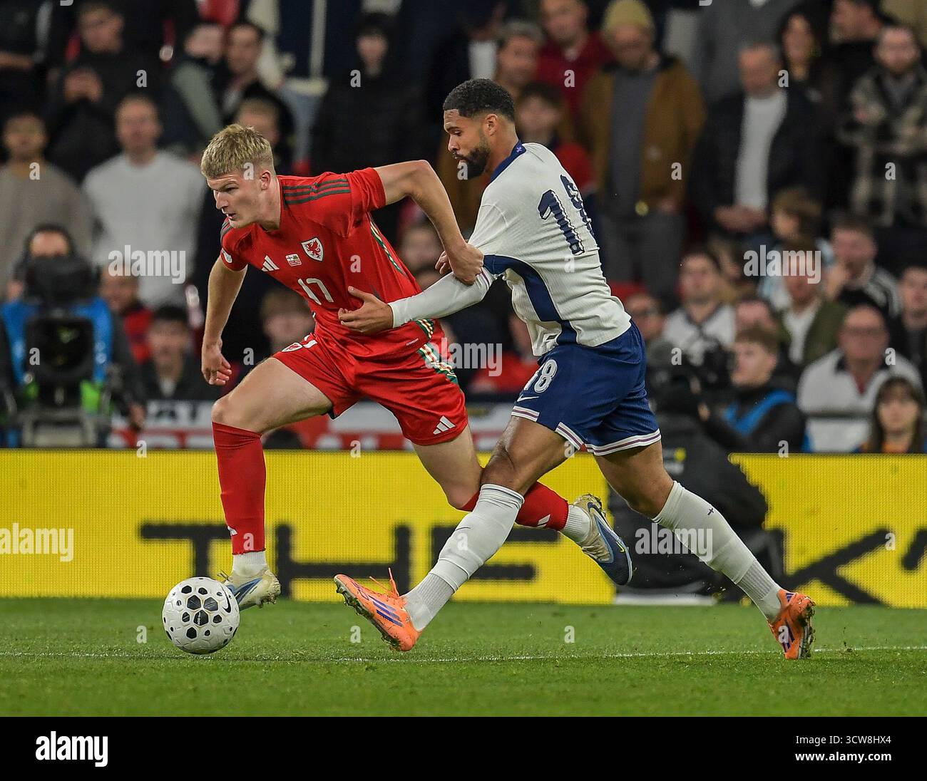 Ruben Loftus-Cheek of England and Jordan James of Wales in action ...