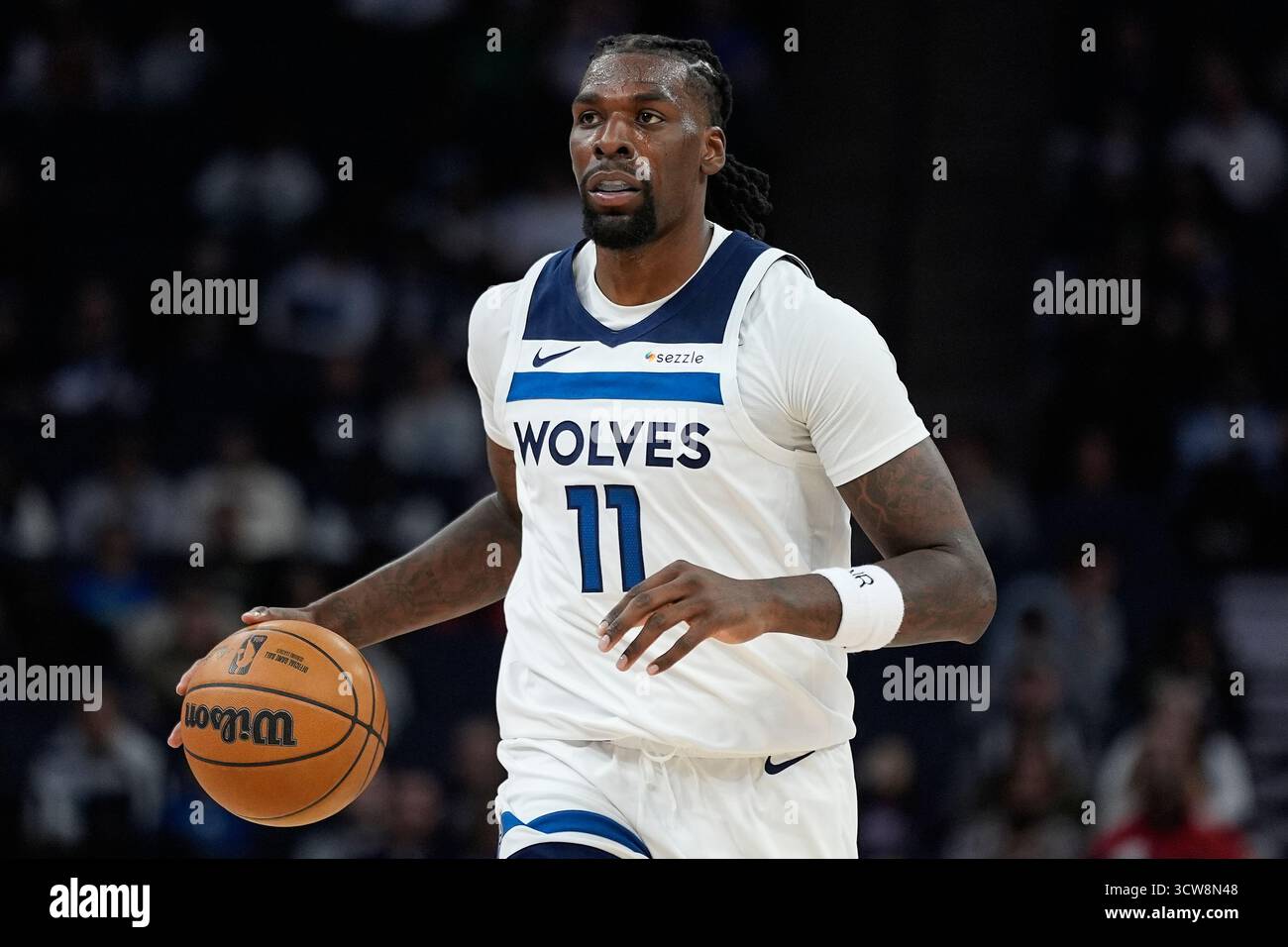 Minnesota Timberwolves center Naz Reid (11) dribbles down the court ...