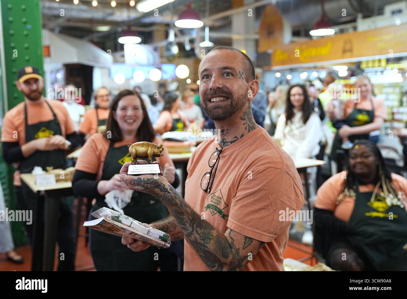 Patrick Moser poses for photographs after winning the Scrapple ...