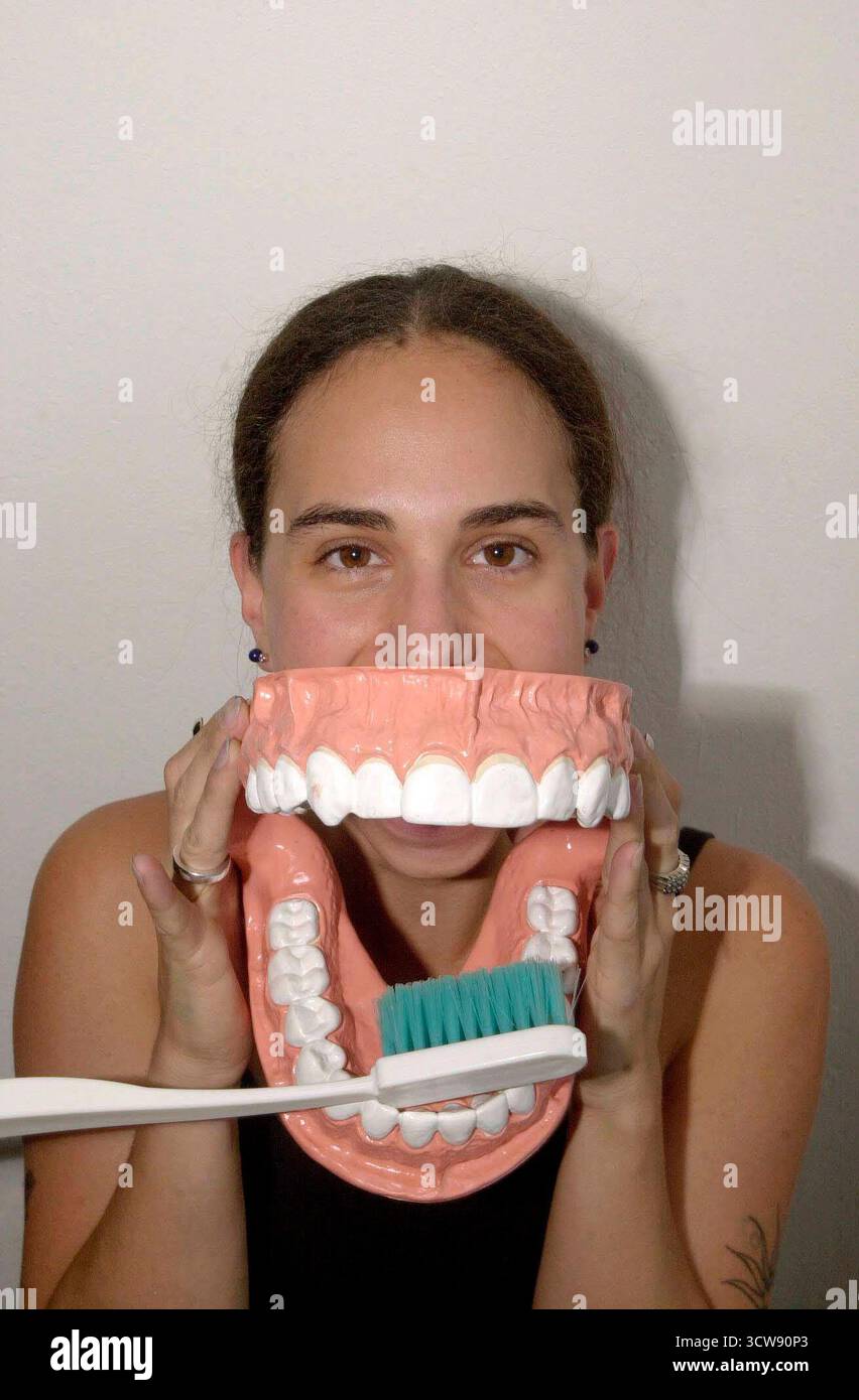 brushing the teeth with a toothbrush and toothpaste, dental hygiene ...