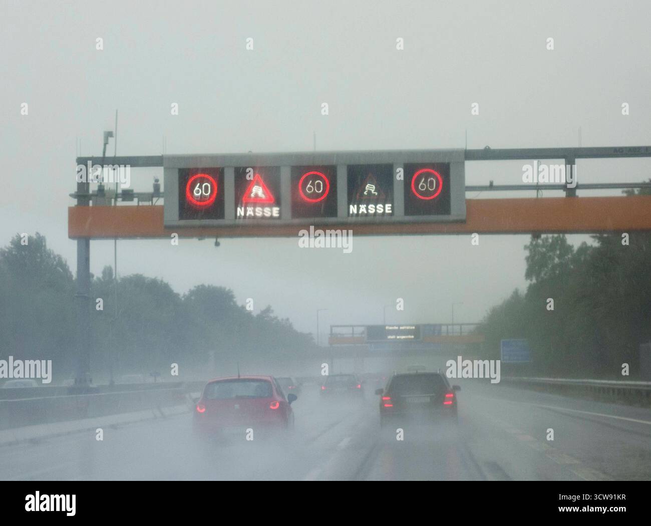 bad weather conditions and poor visibility in road traffic on a rainy ...
