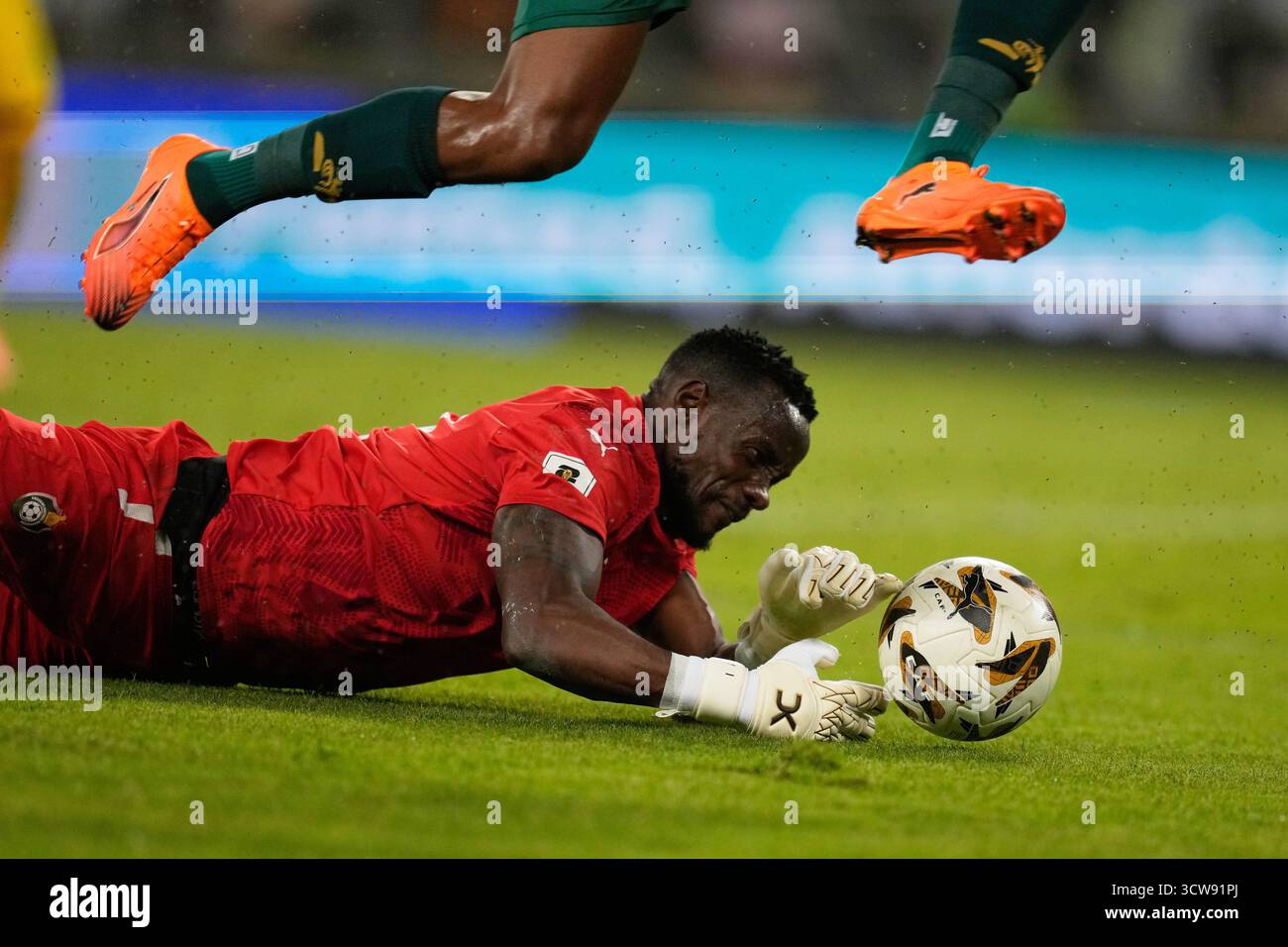 Zimbabwe's goalkeeper Washington Arubi saves during a World Cup 2026 ...