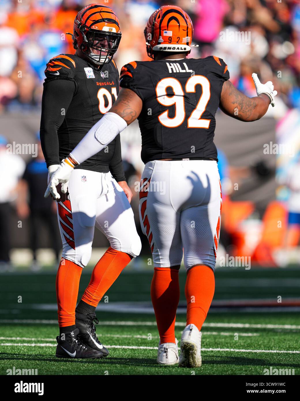 Cincinnati Bengals' Trey Hendrickson (91) celebrates with B.J. Hill (92 ...