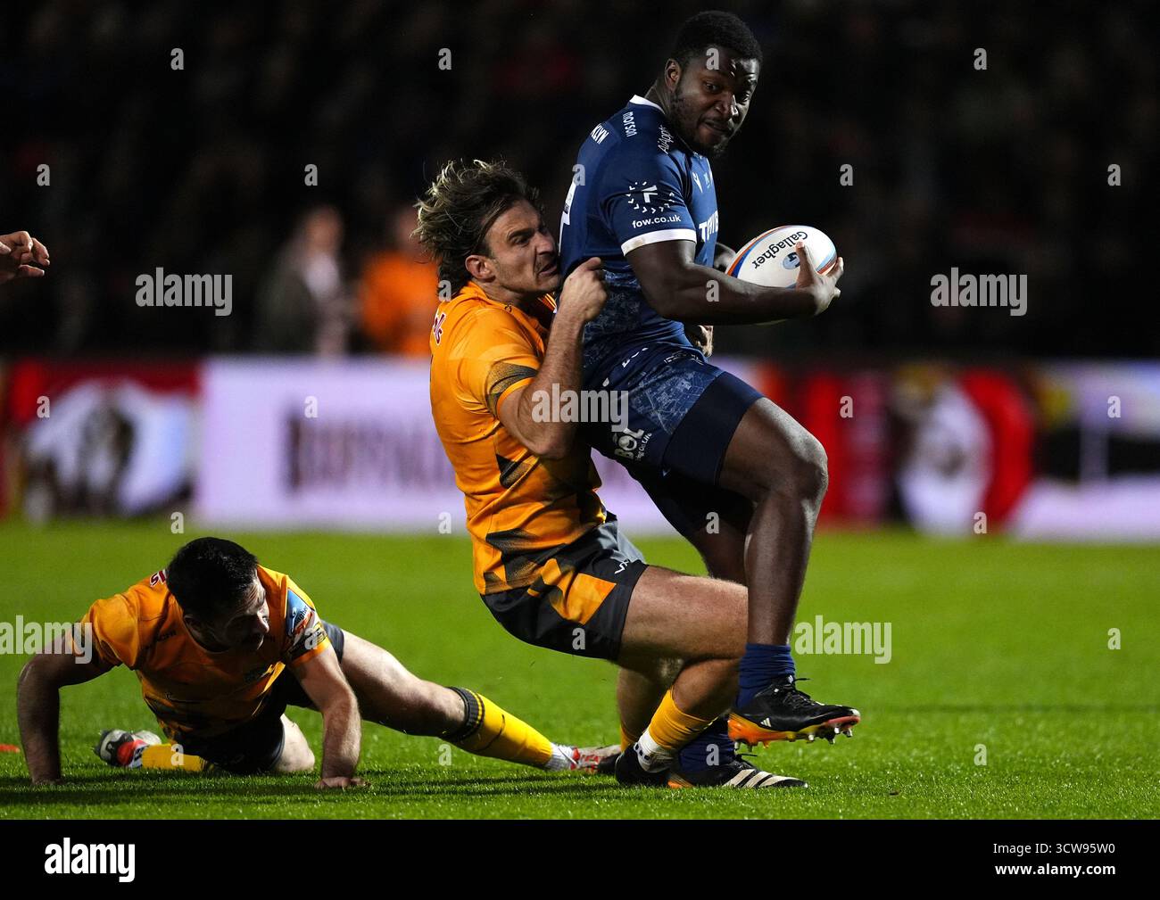 Sale Sharks' Nathan Jibulu (right) is tackled by Newcastle Red Bulls ...