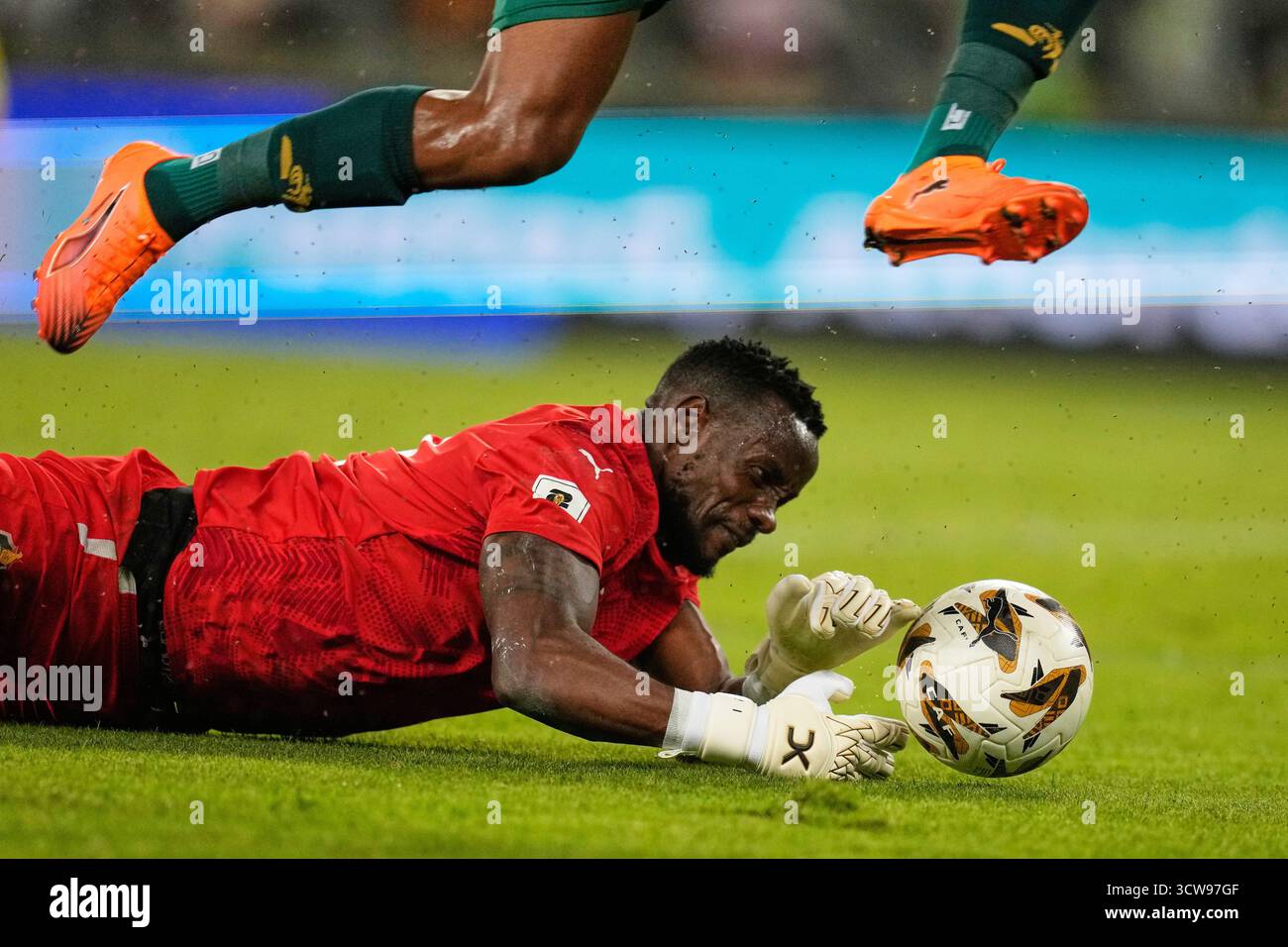 Zimbabwe's goalkeeper Washington Arubi saves during a World Cup 2026 ...
