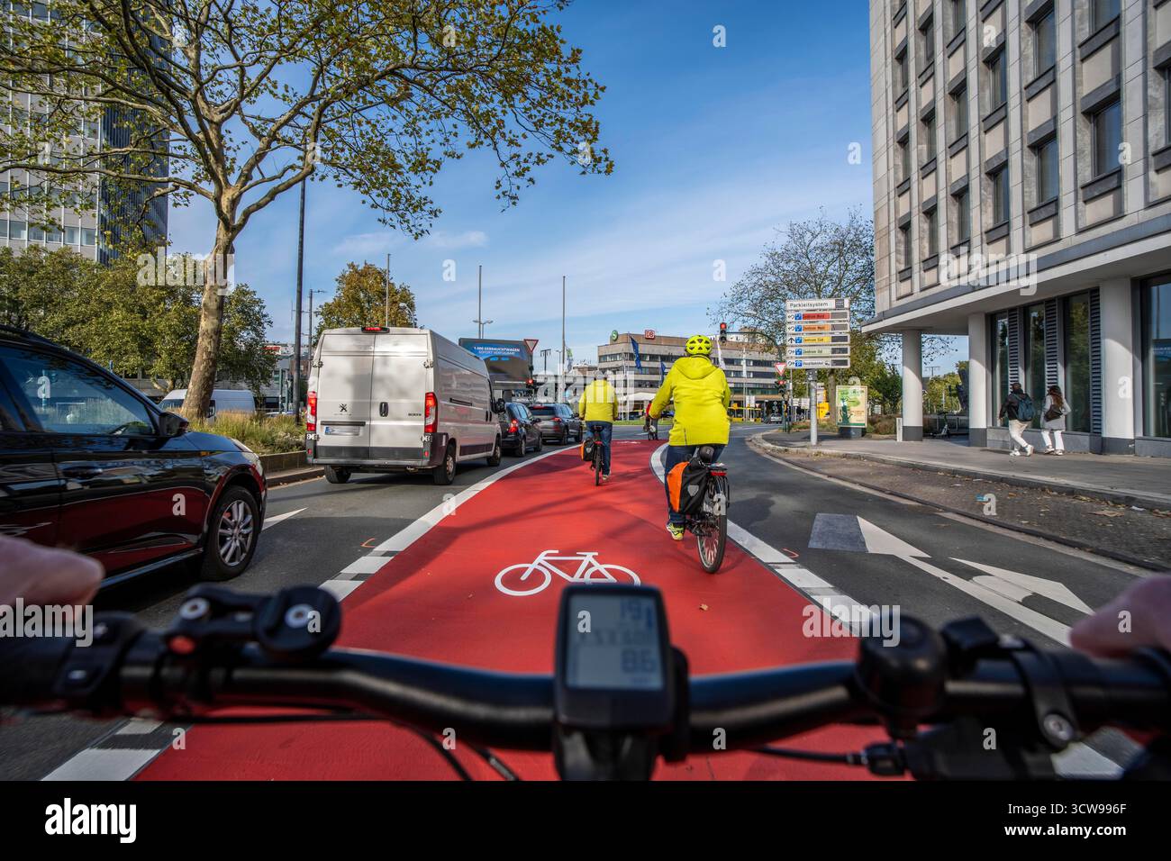 Riding a bike on a bike lane, marked in red to alert drivers to the ...