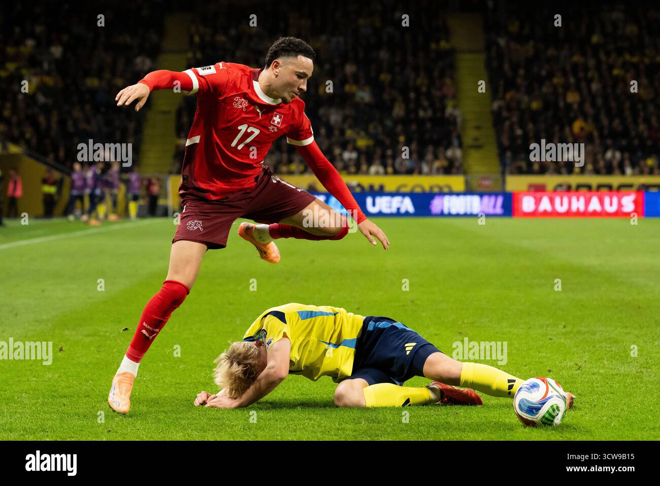 Switzerland's Ruben Vargas, top, and Swedens Daniel Svensson in action ...