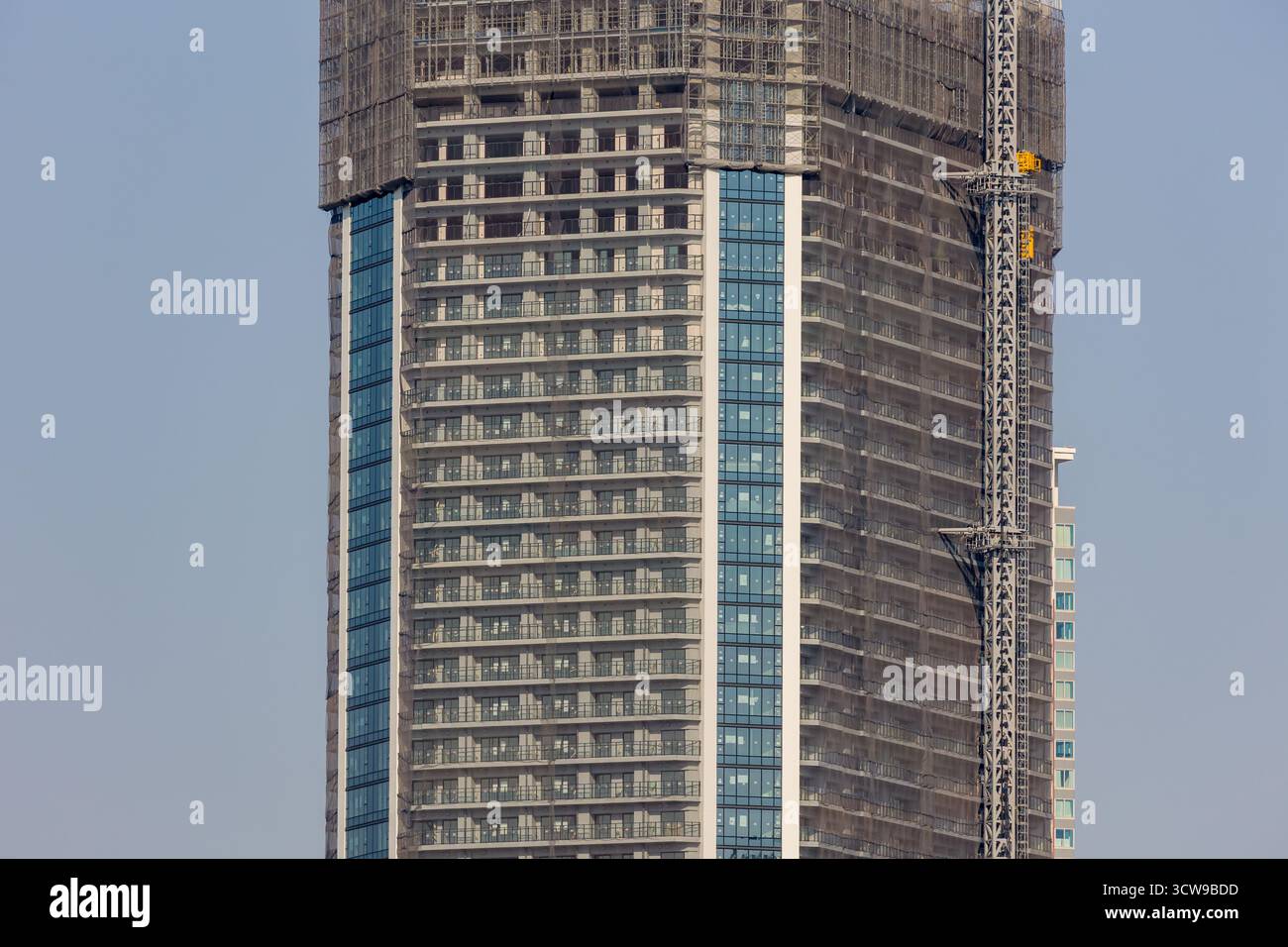 Close up of a new high-rise building with an external construction ...