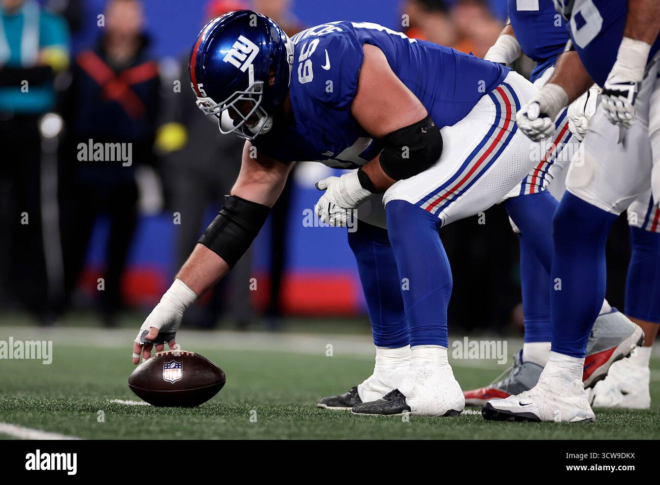 New York Giants guard Austin Schlottmann (65) grabs the ball at the ...