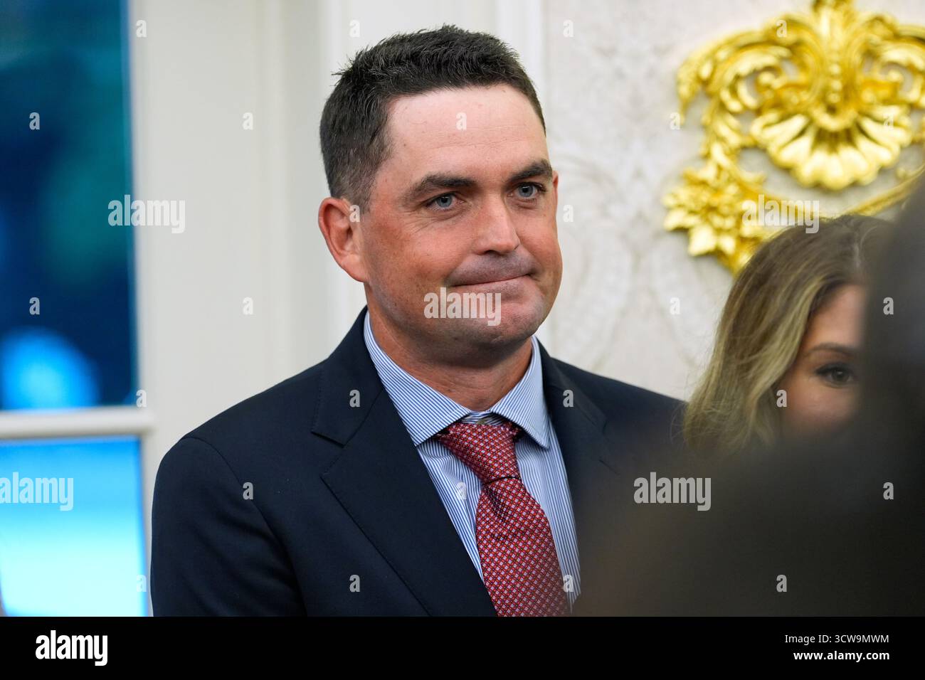 Golfer Keegan Bradley listens as President Donald Trump speaks in the ...