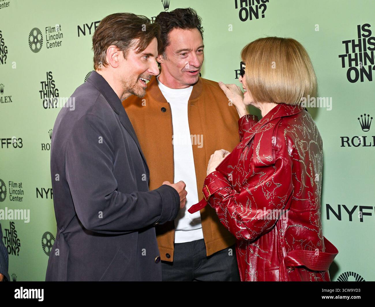 Bradley Cooper, left, Hugh Jackman and Anna Wintour attend the premiere ...