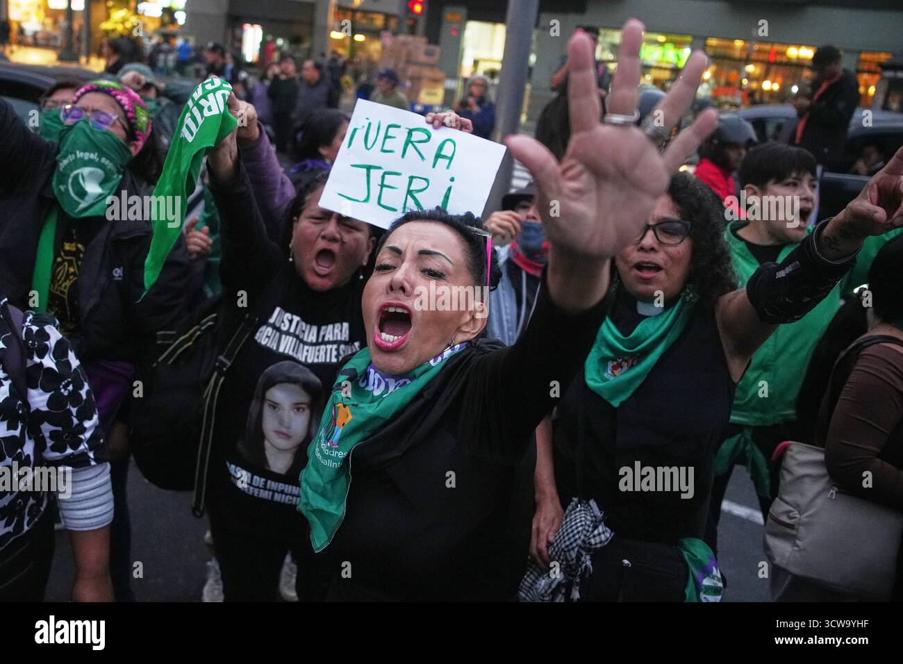 Anti-government demonstrators protest with a poster that reads in ...