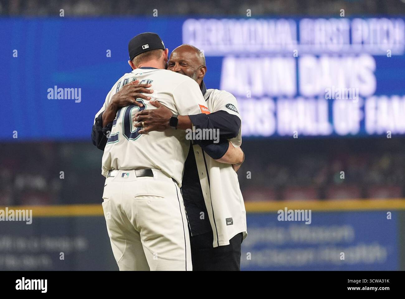 Seattle Mariners right fielder Luke Raley (20) hugs former Seattle ...