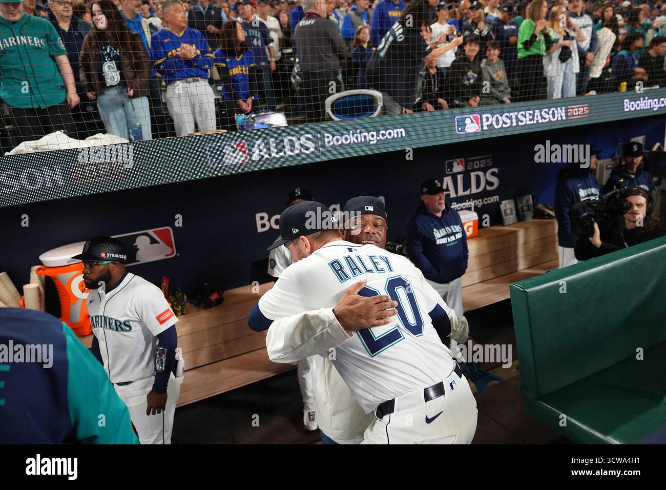Seattle Mariners right fielder Luke Raley (20) hugs Ken Griffey Jr ...