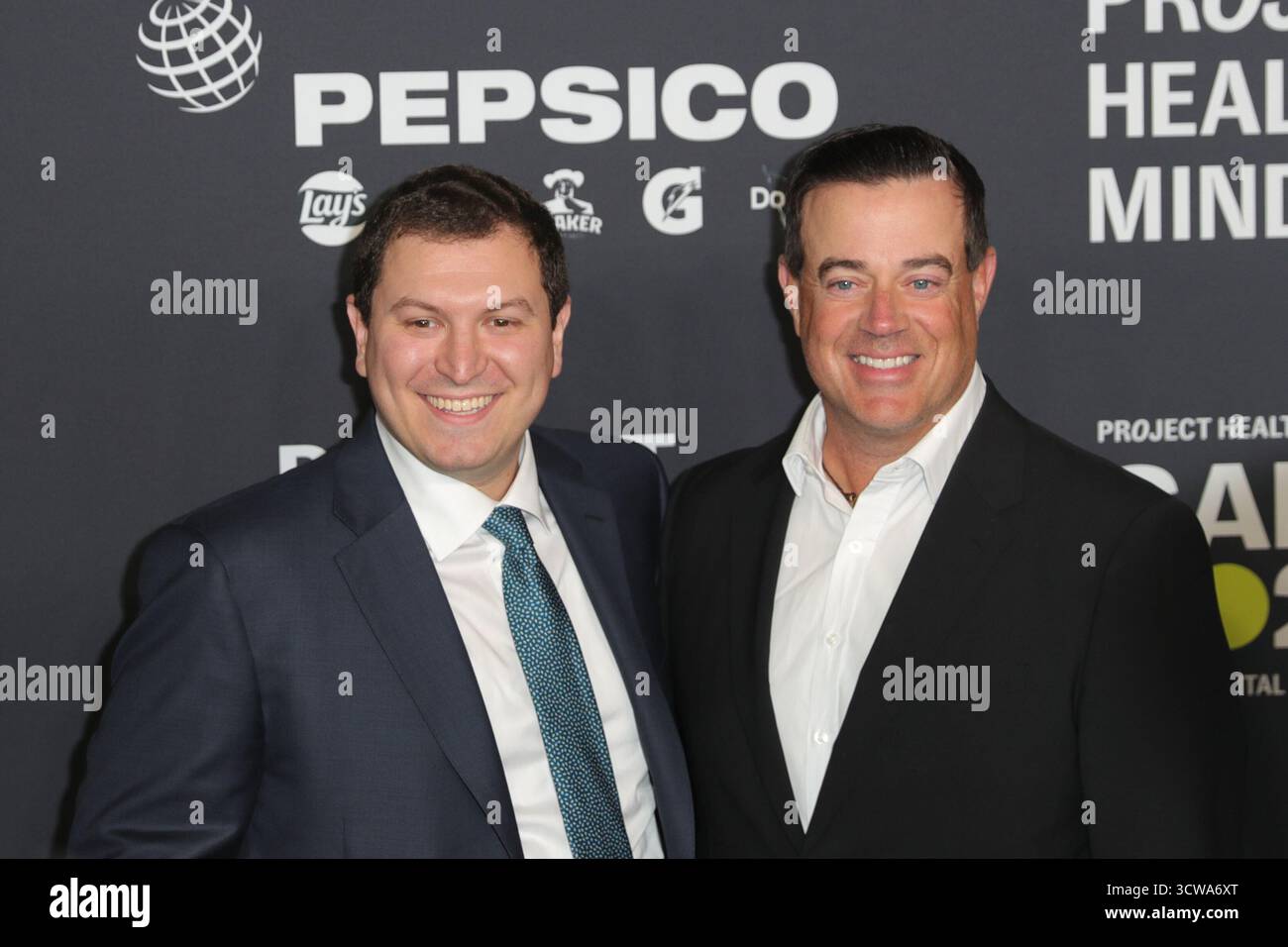 NEW YORK, NEW YORK OCTOBER 9, 2025: Phil Schermer, Carson Daly and Siri ...