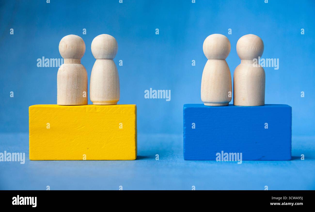 Groups of peg people on staggered yellow and blue blocks convey ...