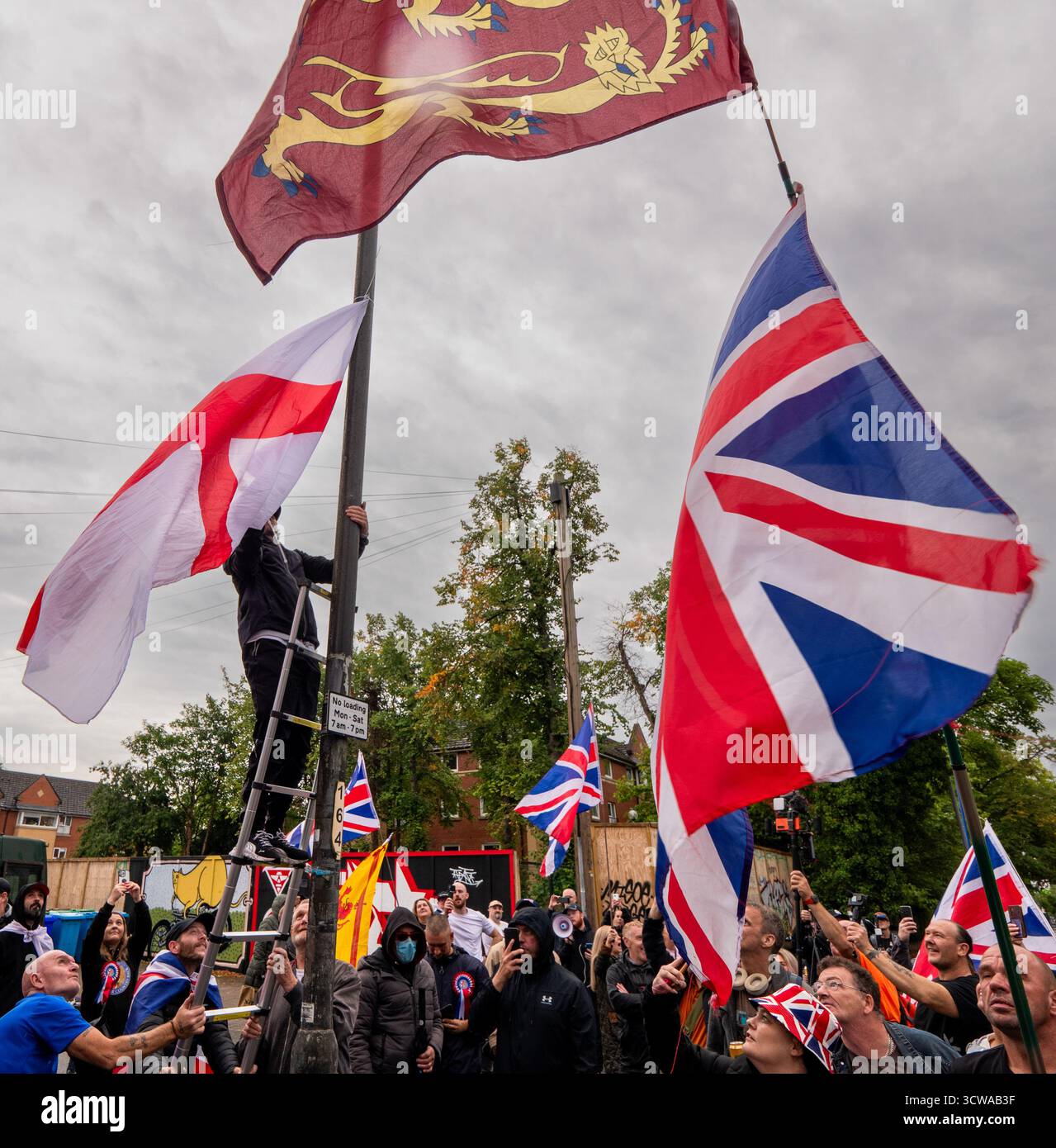 English, British and Union flags being placed up lamp posts in ...
