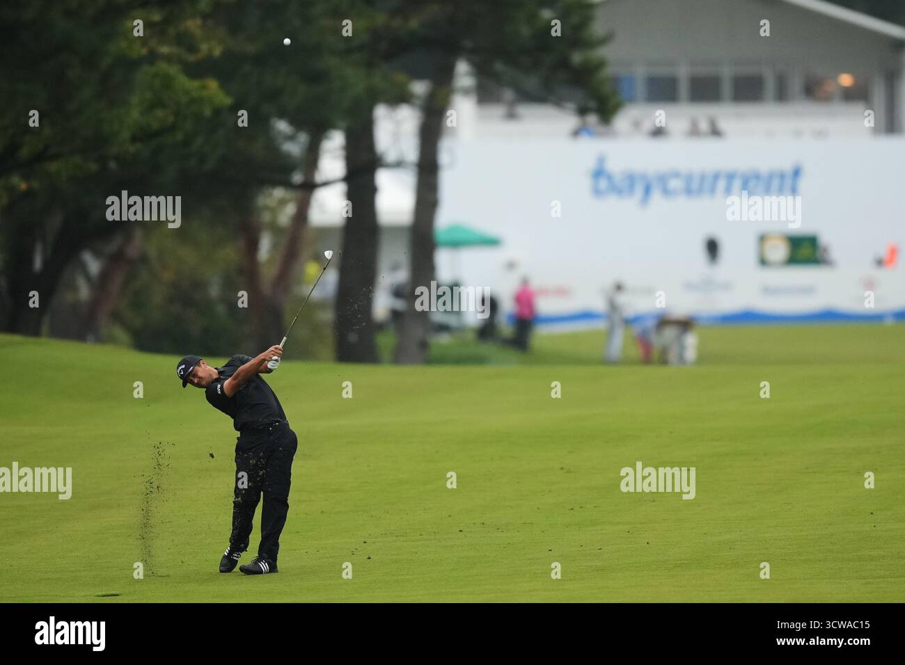 Xander Schauﬀele, of the U.S., hits from the fairway on the first hole ...