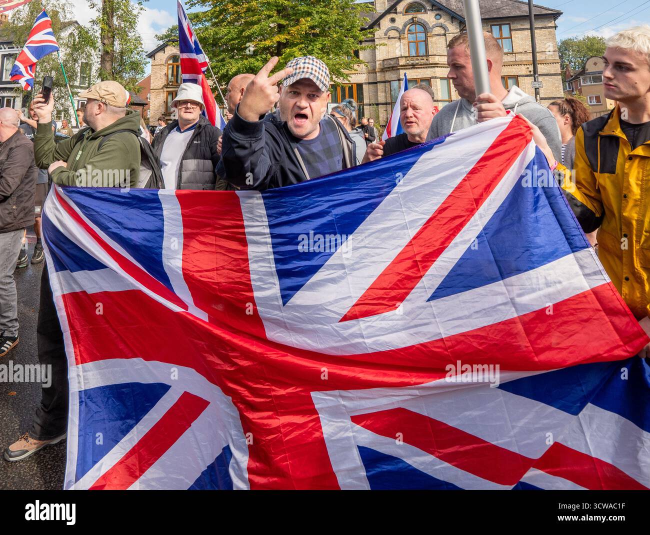 Anti migrant protesters with Union flag outside hotel used to house ...