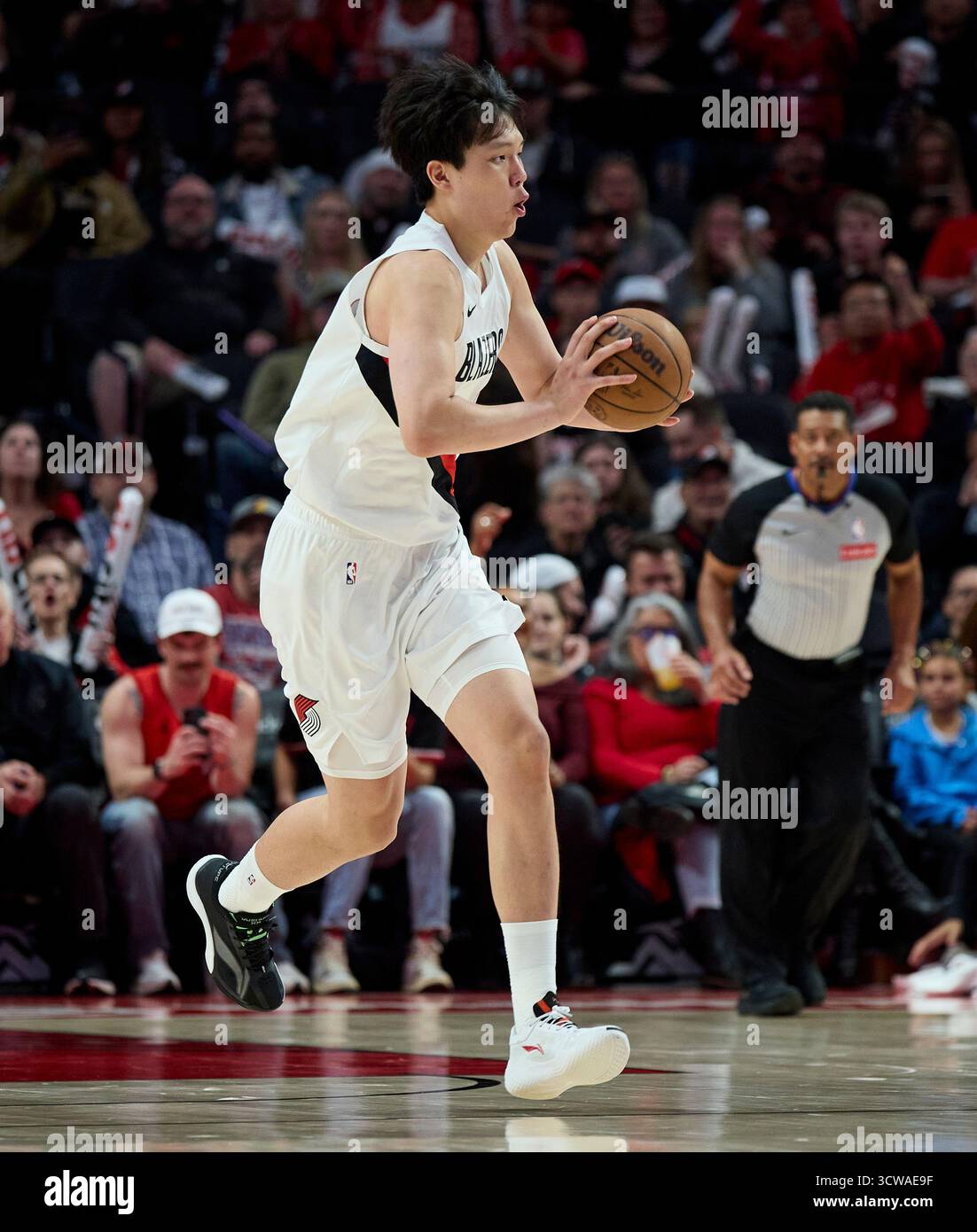 Portland Trail Blazers center Yang Hansen passes the ball during the ...