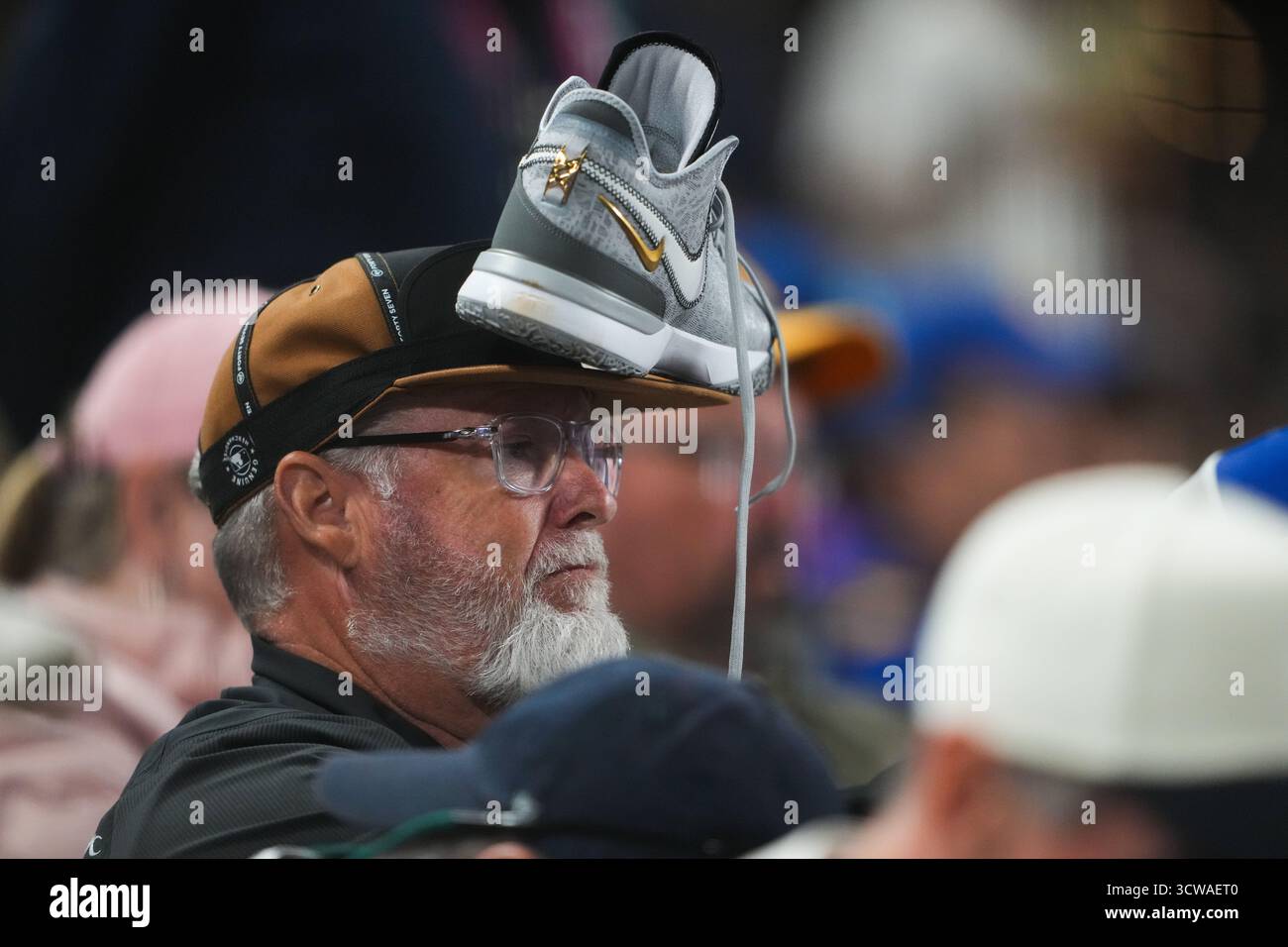 A fan wears a "rally shoe" during the 13th inning in Game 5 of baseball ...